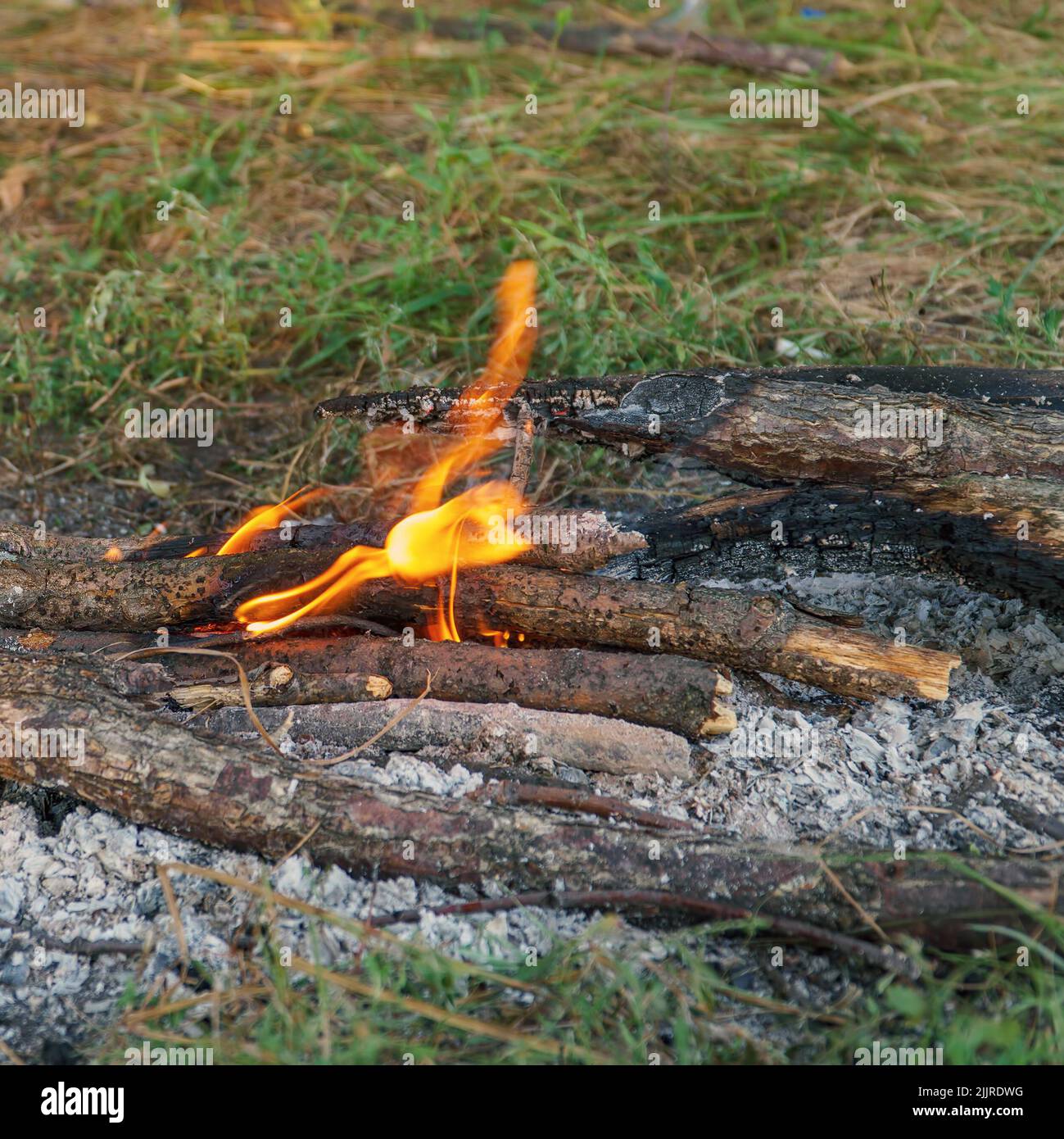 View of a small campfire in the camp Stock Photo - Alamy