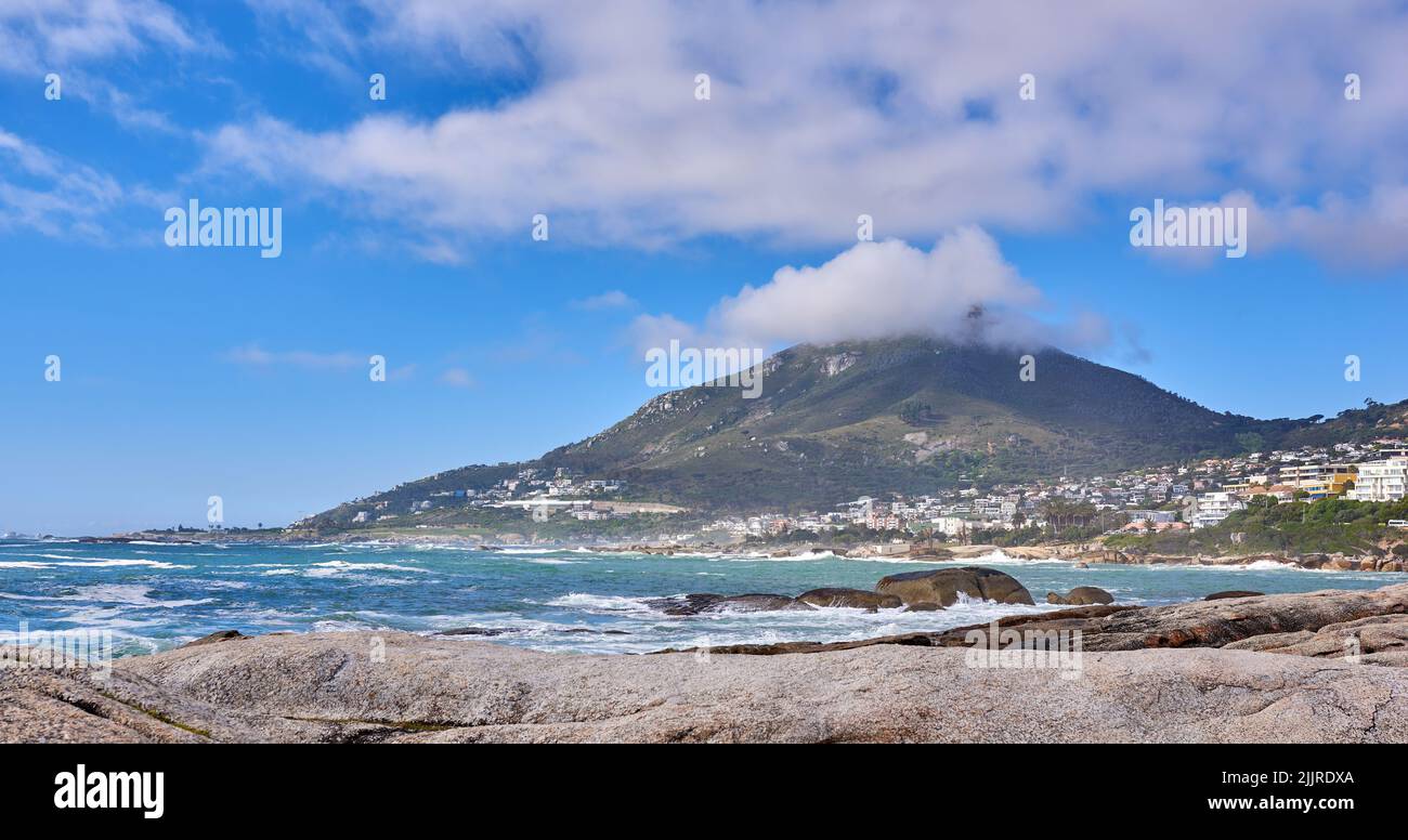 Beautiful view of a blue ocean on the rocky coast of Western Cape ...