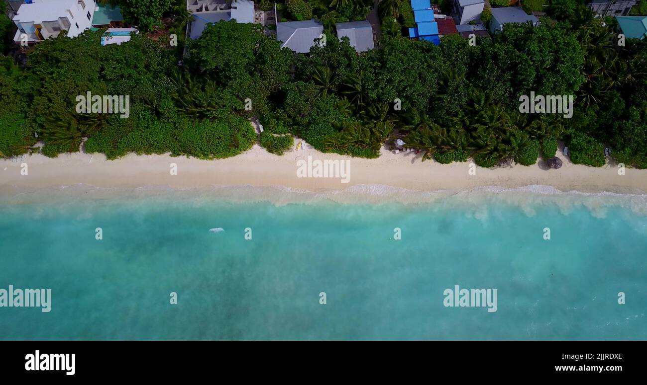 An aerial shot of an azure beach near a tropical forest Stock Photo - Alamy