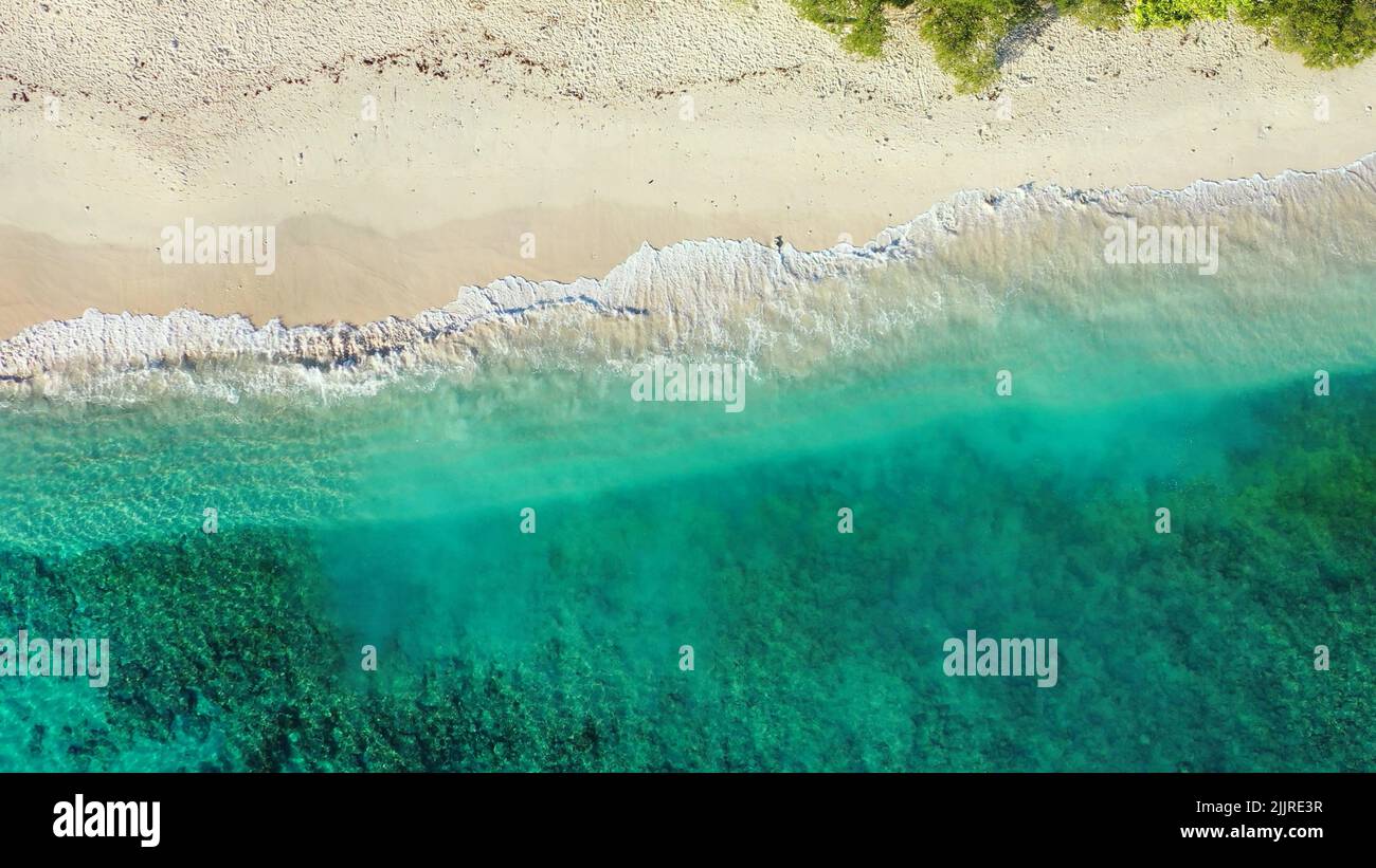 An aerial view of sea waves breaking beach in Maldives Stock Photo - Alamy