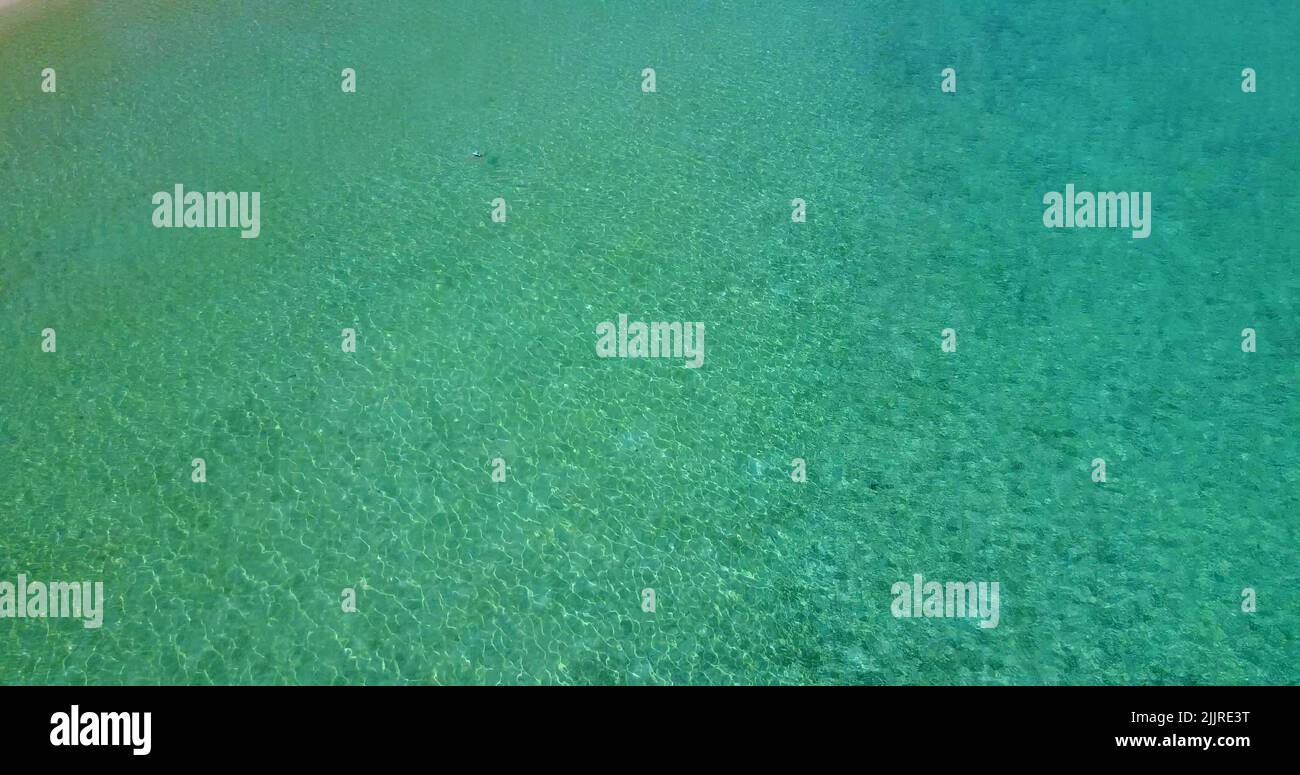 An aerial view of sea with emerald water Stock Photo - Alamy