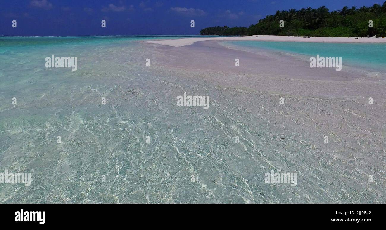An aerial view of sea surrounded by growing trees in Maldives Stock ...