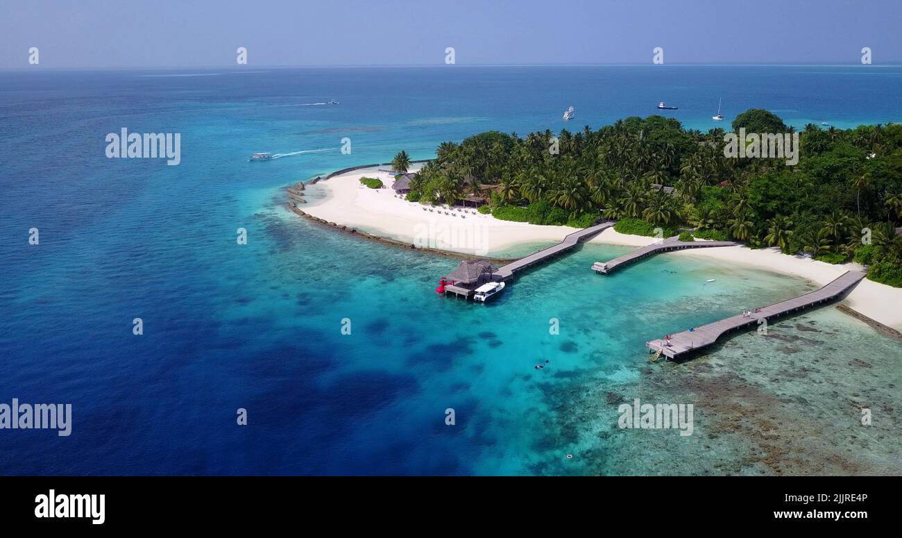 An aerial view of sea surrounded by growing trees in Maldives Stock ...