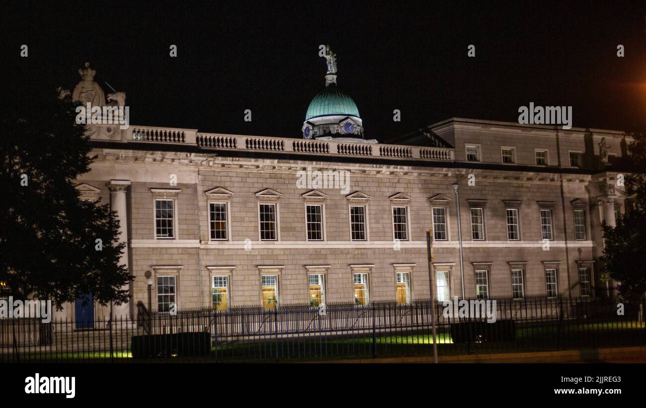 A low angle view of an ancient building in Dublin, Ireland at night ...