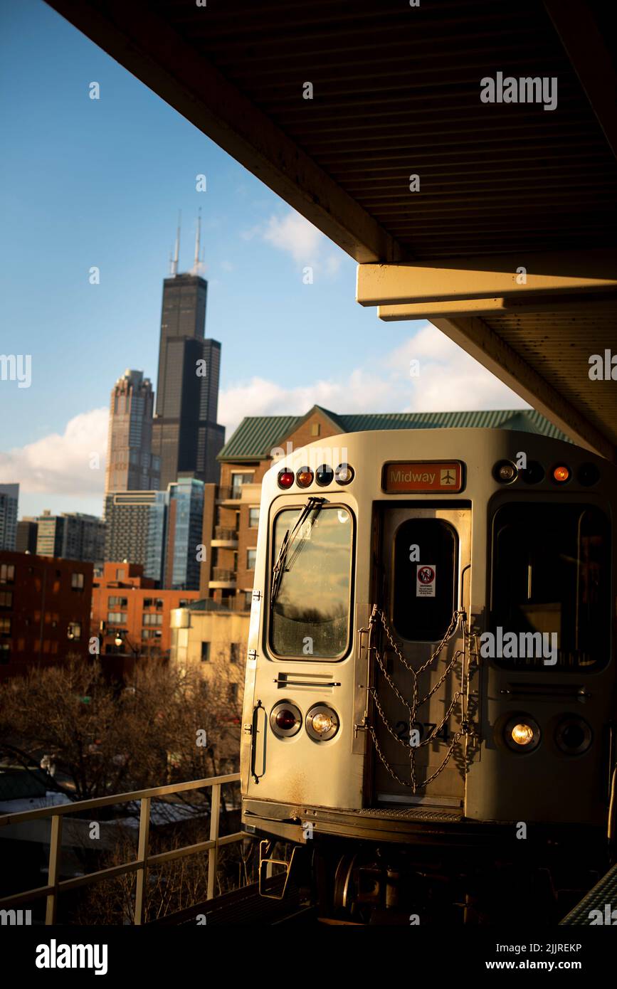 A backside of the train on the railroad against the modern buildings in ...
