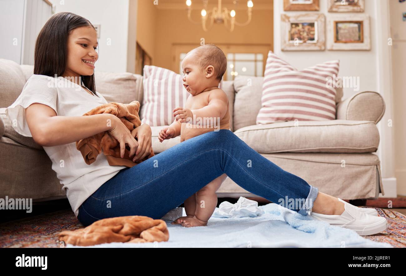 Mother dressing a child hi-res stock photography and images - Alamy