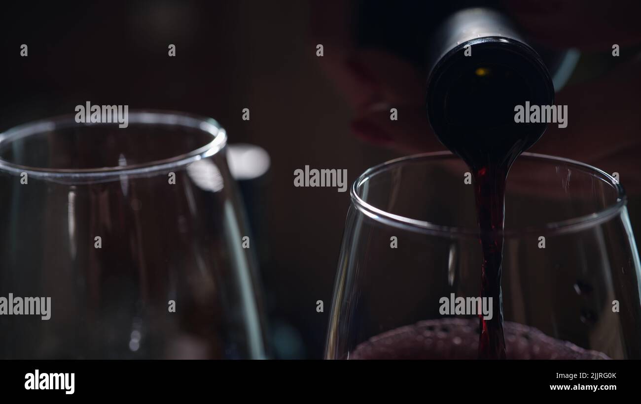 Pouring red wine into glass, tasting and degustation Stock Photo - Alamy