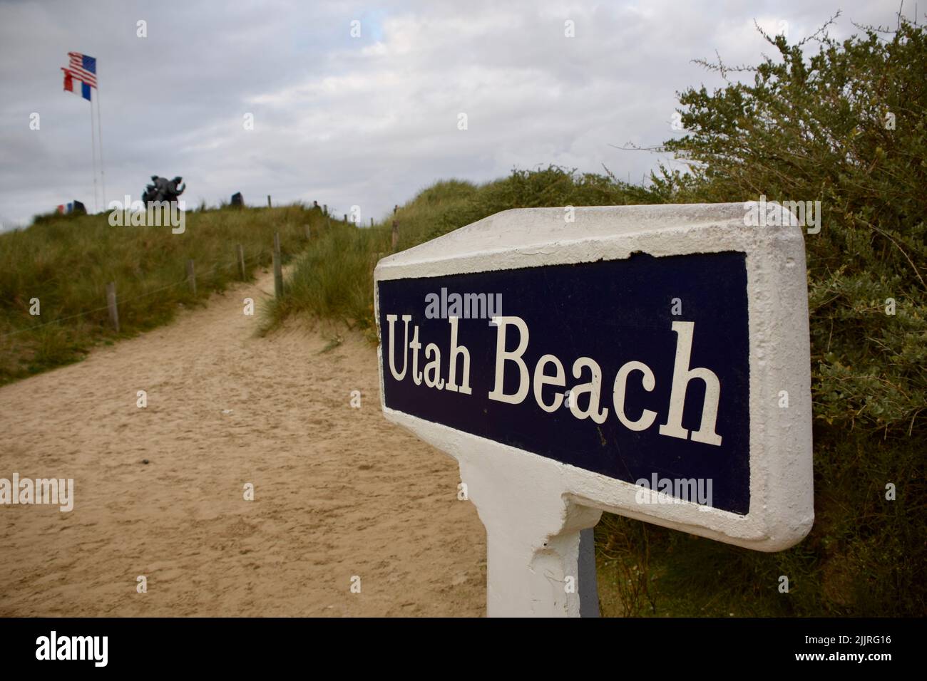 A sandy path with a ''Utah Beach'' sign under the gloomy sky Stock ...