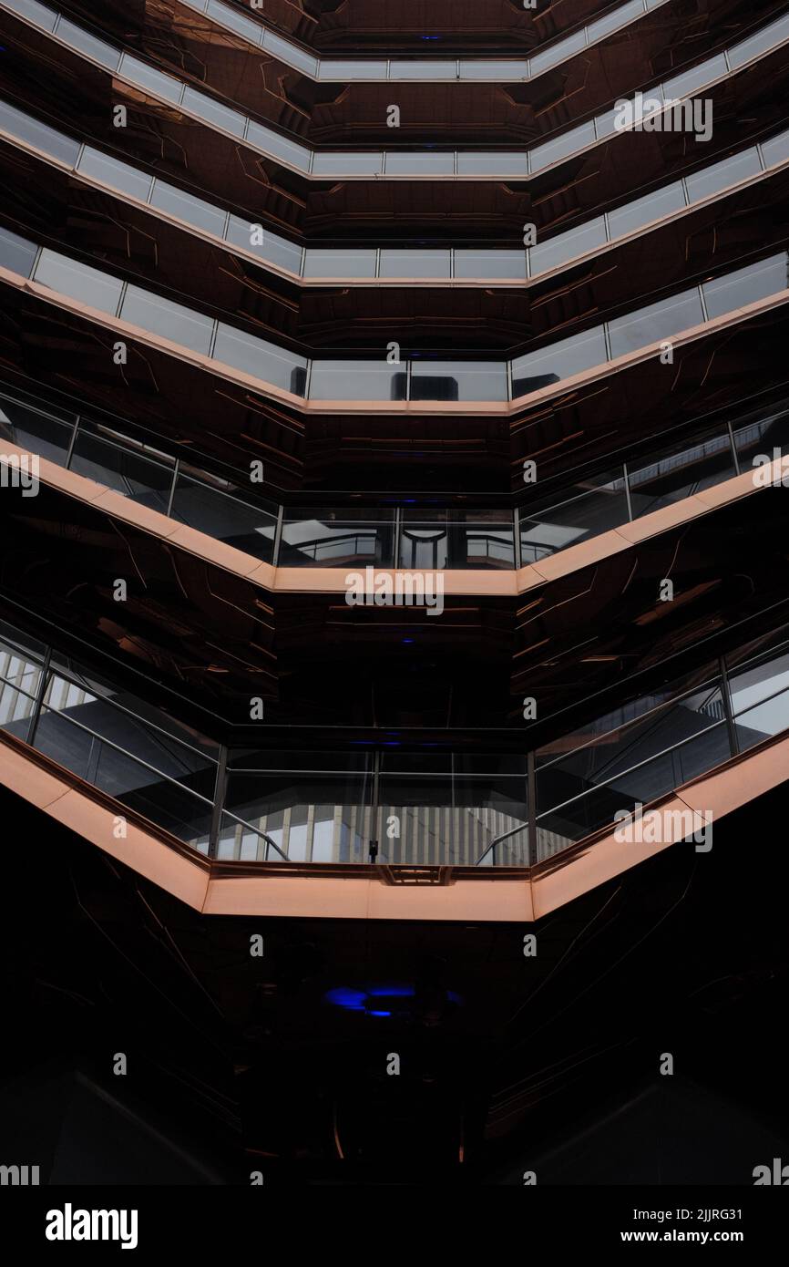 A vertical low angle shot of the modern glass Hudson Yards building in ...