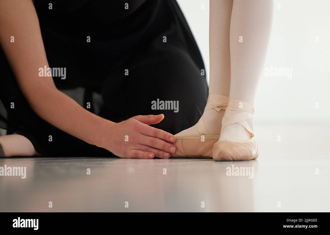 Correctly her stance and position. Closeup shot of a ballet teacher ...