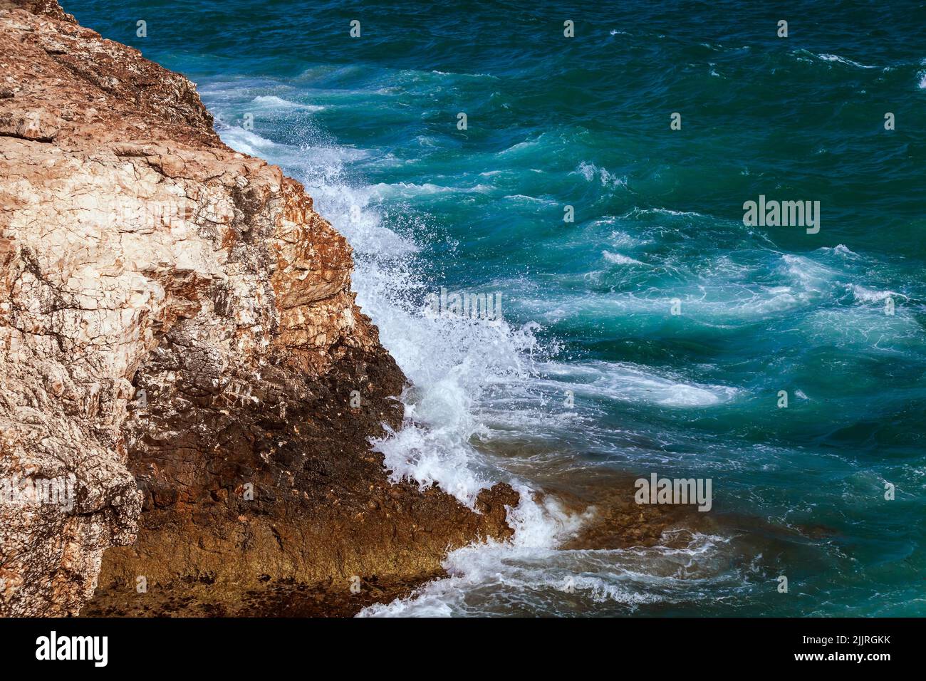 Wet coastal rocks and waters of Mediterranean Sea. Summer landscape of ...