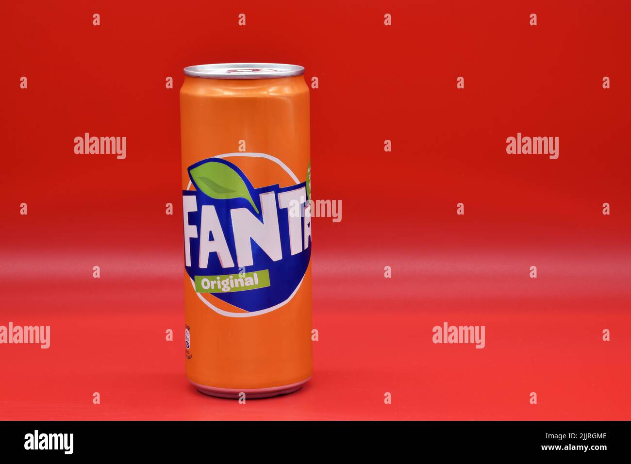 Can of Fanta soda isolated on red background Stock Photo - Alamy