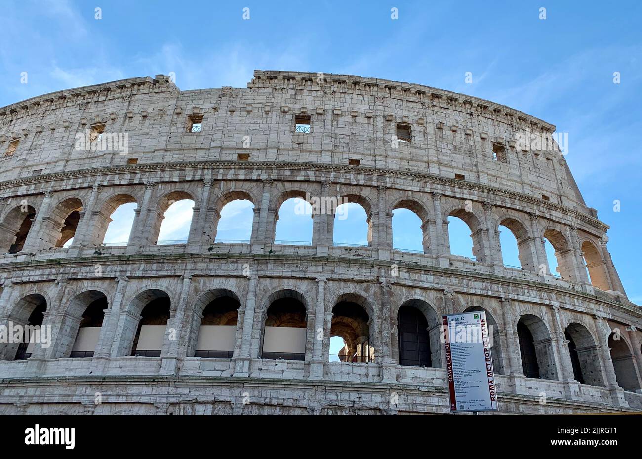 The ancient Colosseum against the blue sky Stock Photo - Alamy