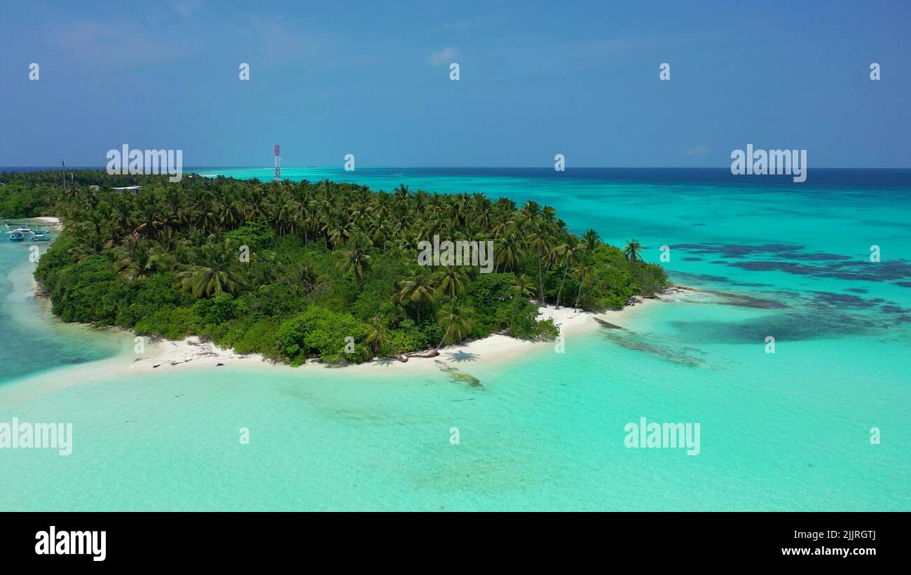 An aerial view of an island with trees surrounded by ocean Stock Photo ...