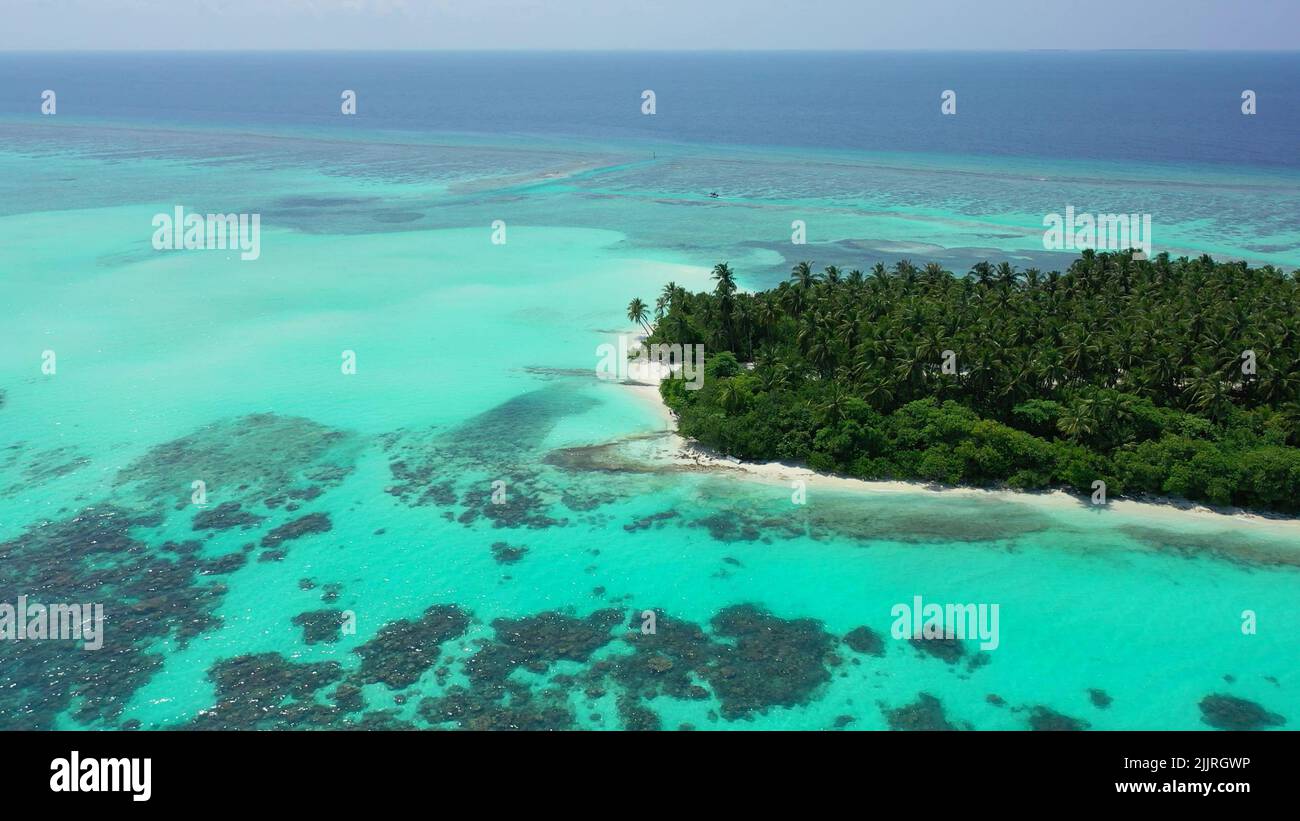 An aerial view of an island with trees surrounded by ocean Stock Photo ...