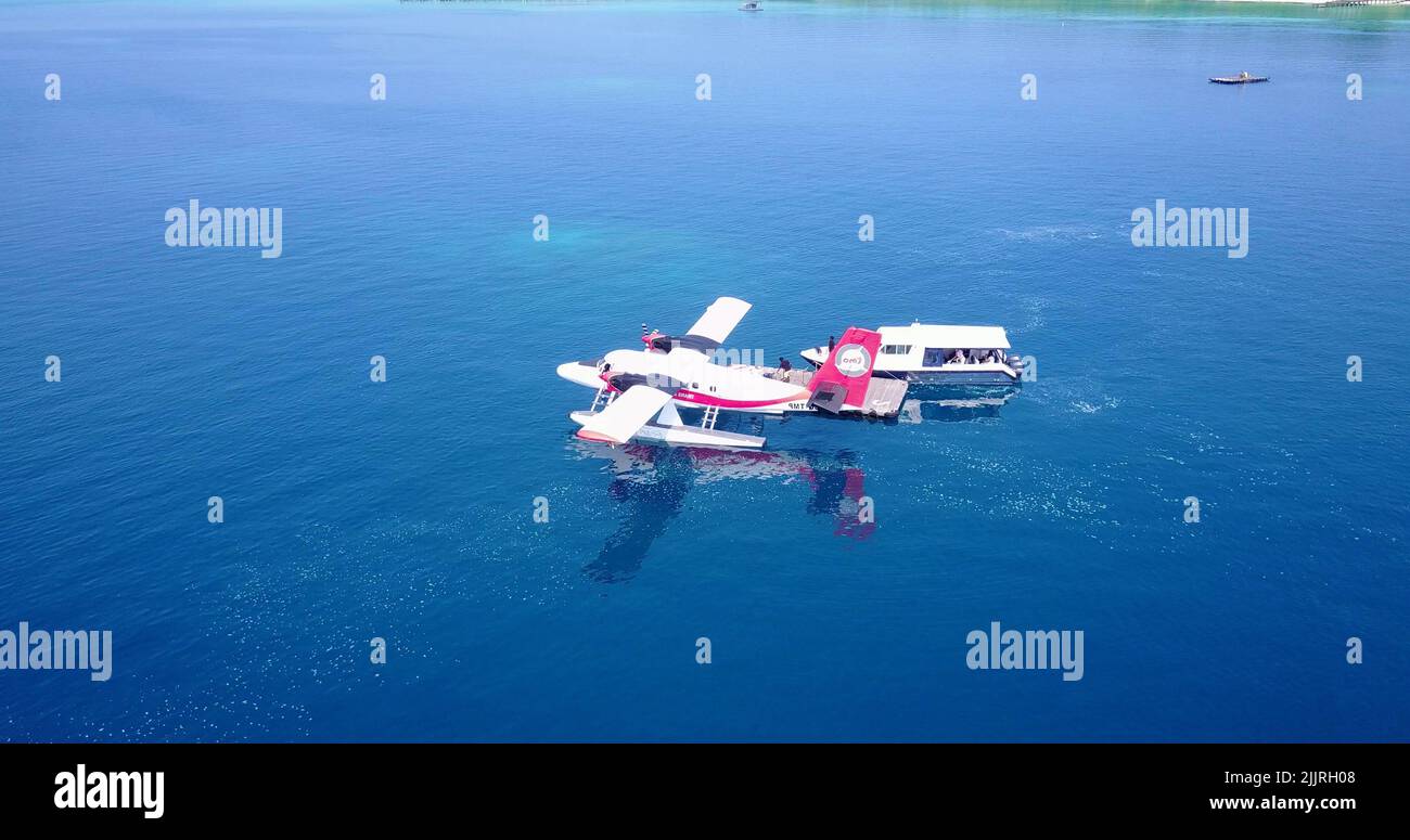 A bird's eye view of a seaplane on the blue water in the beautiful ...