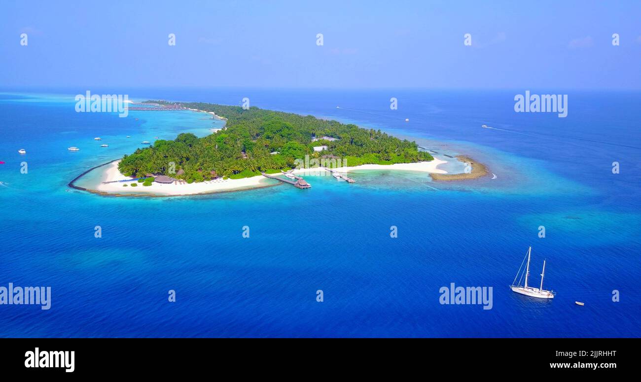 An aerial drone shot of a tropical untouched island in Southeast Asia ...