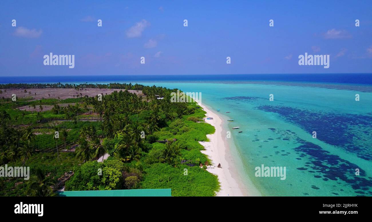An aerial view of an island with trees by the ocean Stock Photo - Alamy