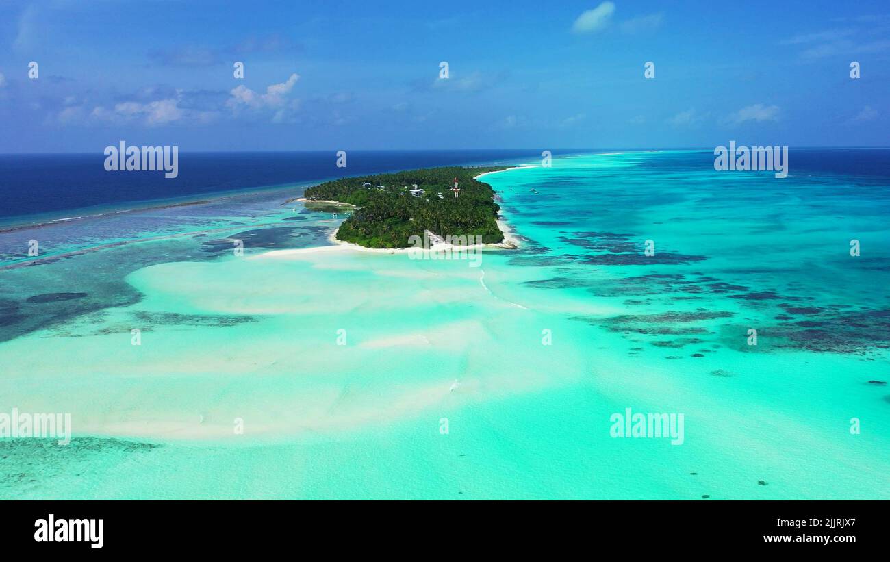 An aerial view of an island with trees in the middle of the ocean Stock ...
