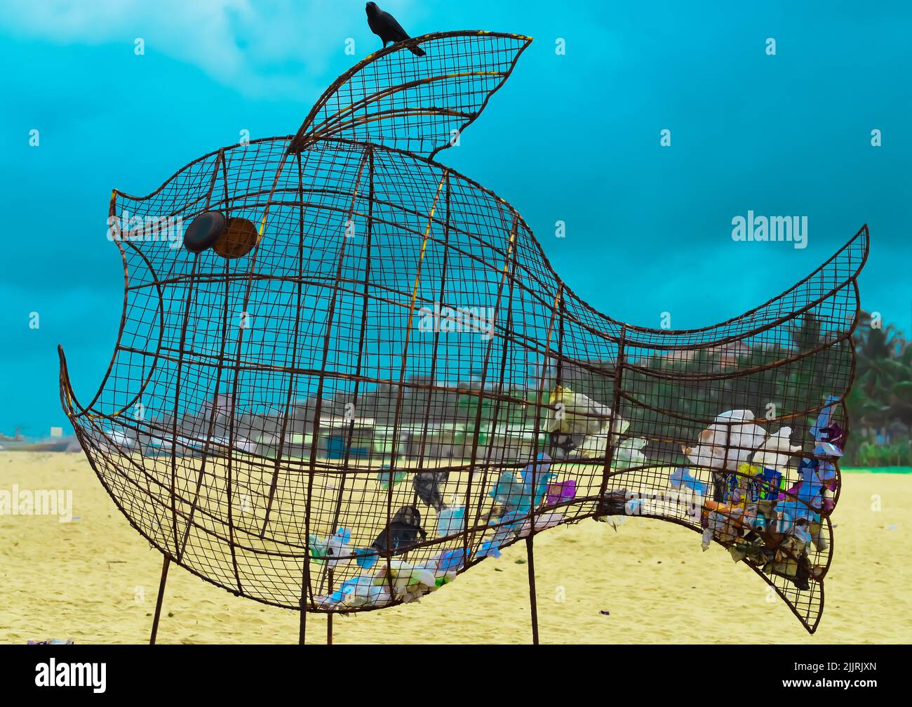Fish-shaped Dustbin made from discarded metal sticks to collect garbage ...