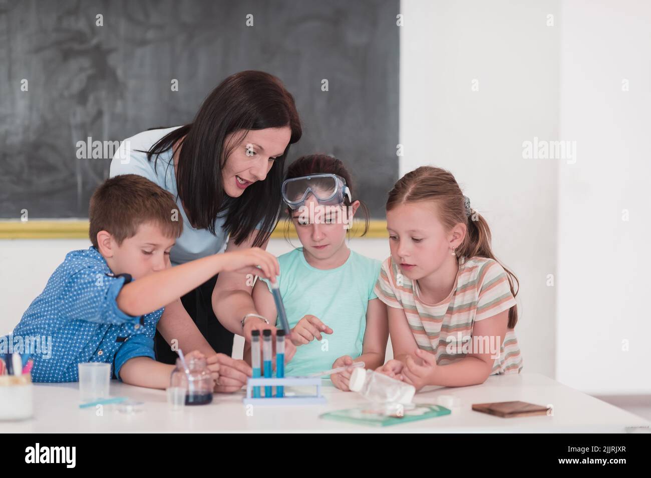 Elementary School Science Classroom: Enthusiastic Teacher Explains ...