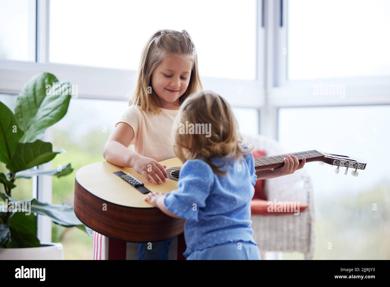 This is so much fun. two little sisters playing the guitar at home ...