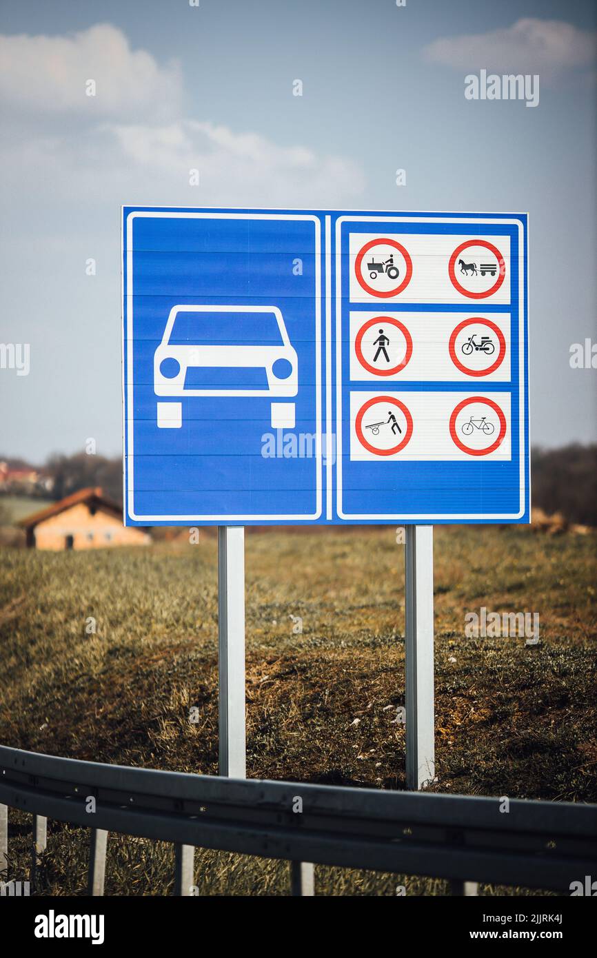 A vertical shot of traffic signs on the road in Brcko, Bosnia and ...