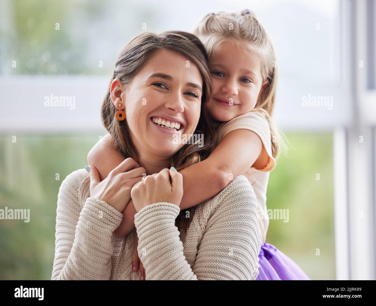 She keeps this smile on my face. a little girl giving her mother a hug ...