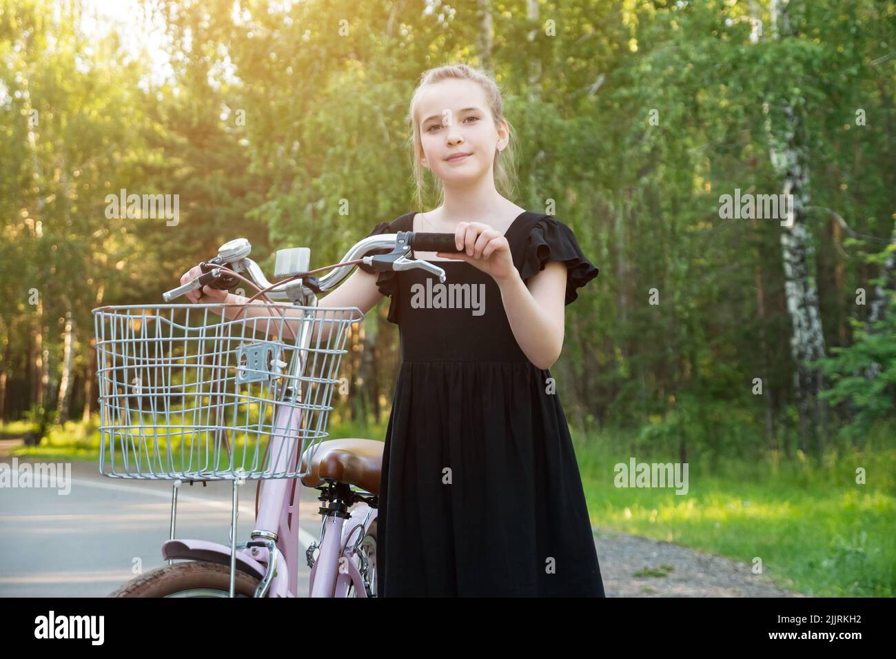 Girl looks with satisfied expression and smiles closeup Stock Photo - Alamy