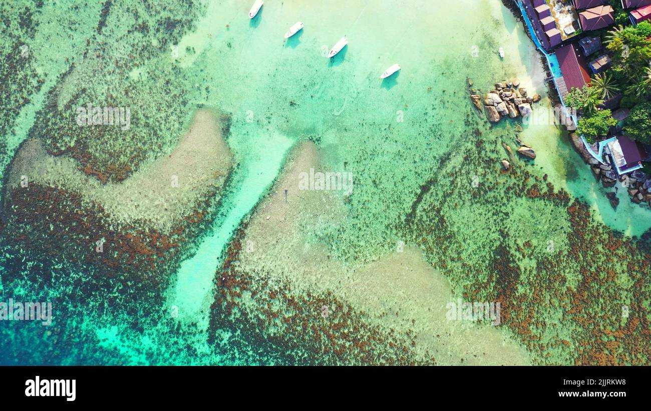 A beautiful view of a sea with boats and an island on a sunny day in ...
