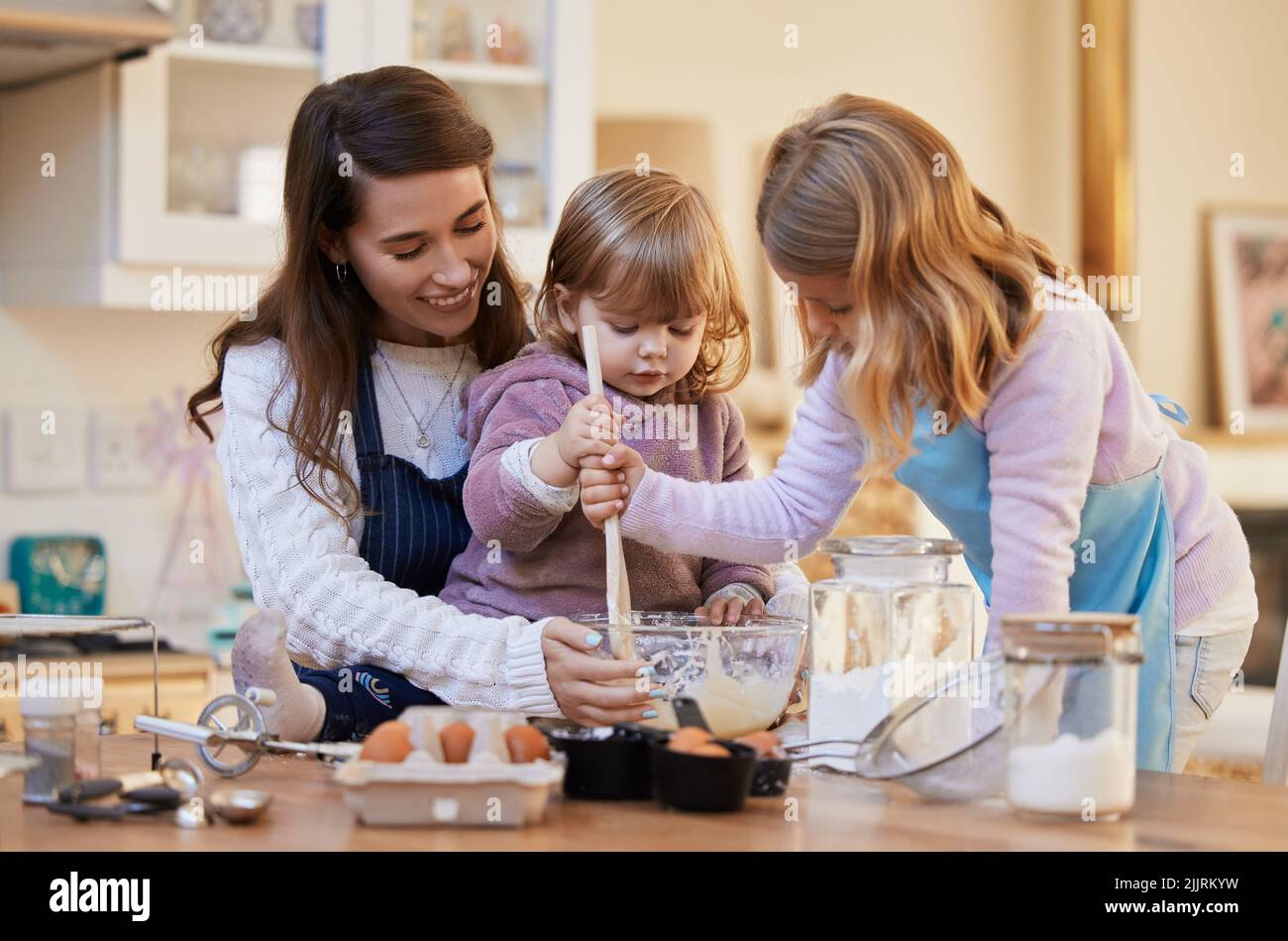Ill always remember these moments. a young mother baking with her ...