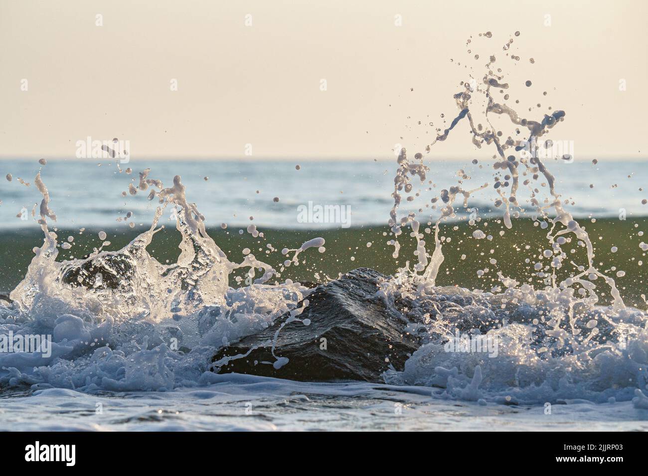 A beautiful shot of a moment of splash made while the water hitting a ...