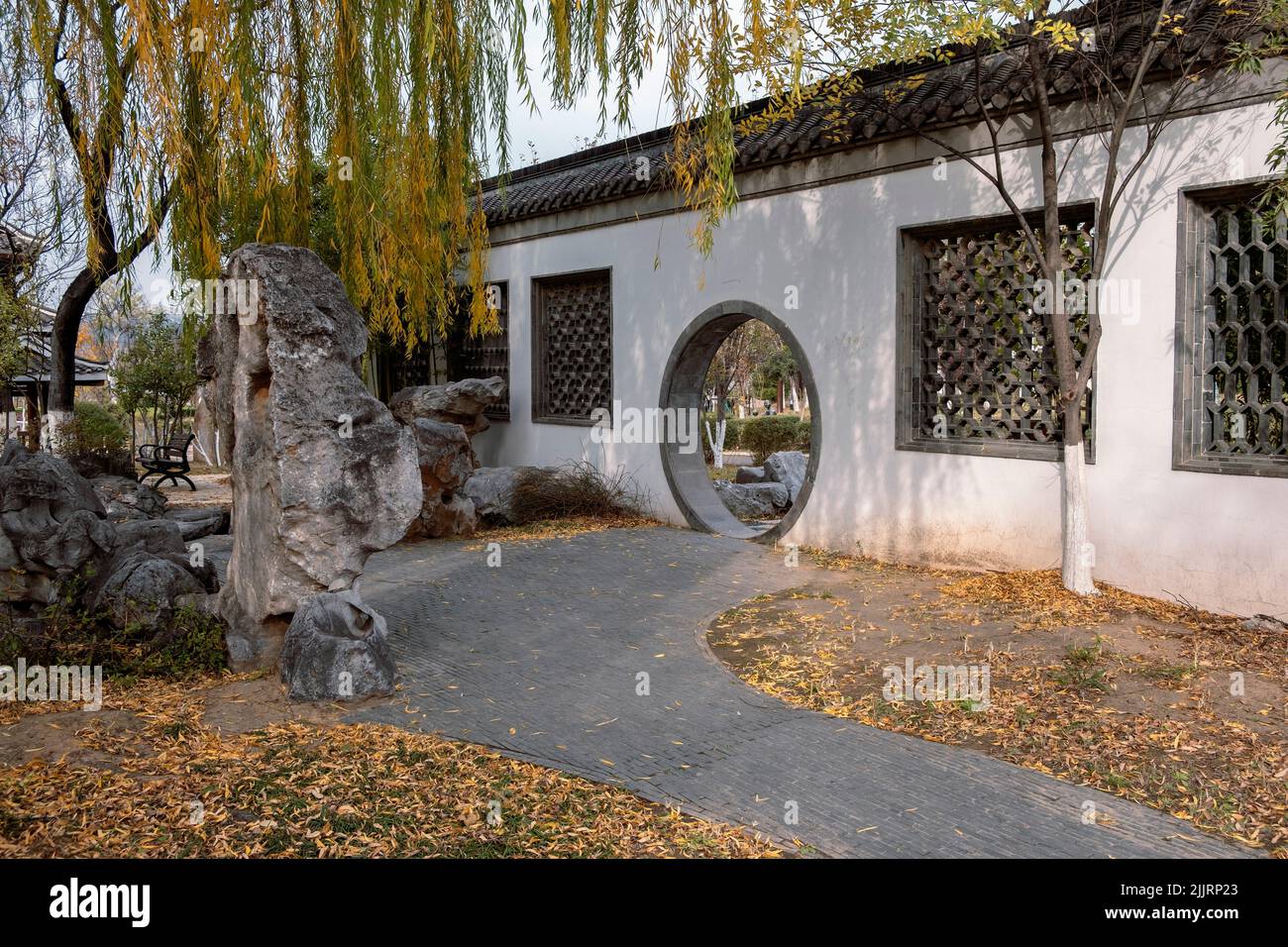 circle shape entrance into Chinese garden by autumn Stock Photo - Alamy