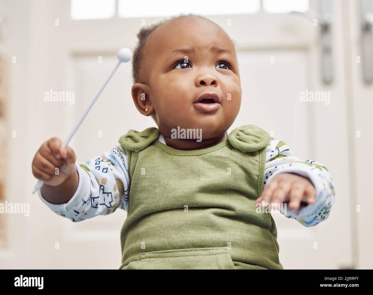 Child pick up toy hi-res stock photography and images - Alamy