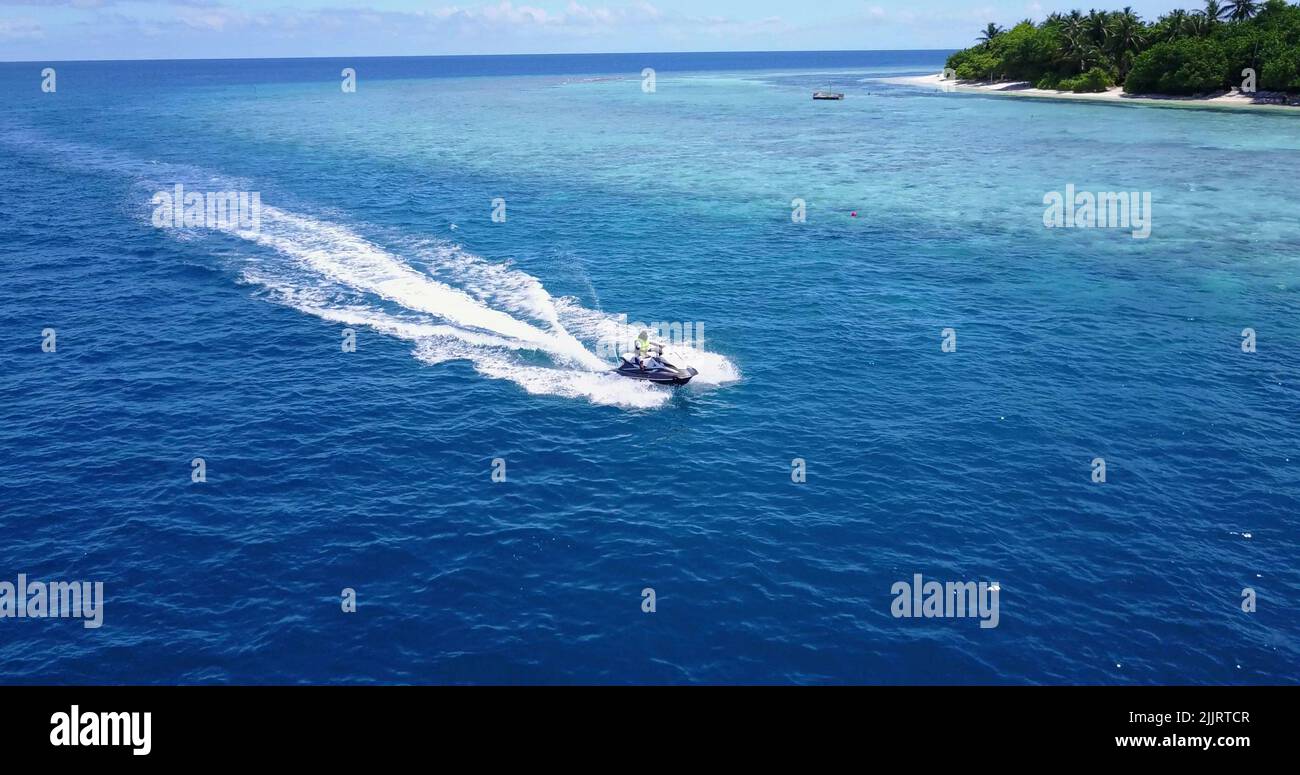 An aerial view of a boat sailing in the ocean in the Maldives Stock ...