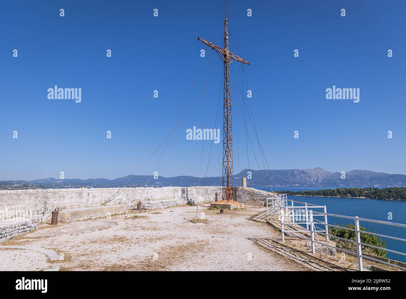 Metal cross on the top of Old Venetian Fortress in Corfu town on a ...