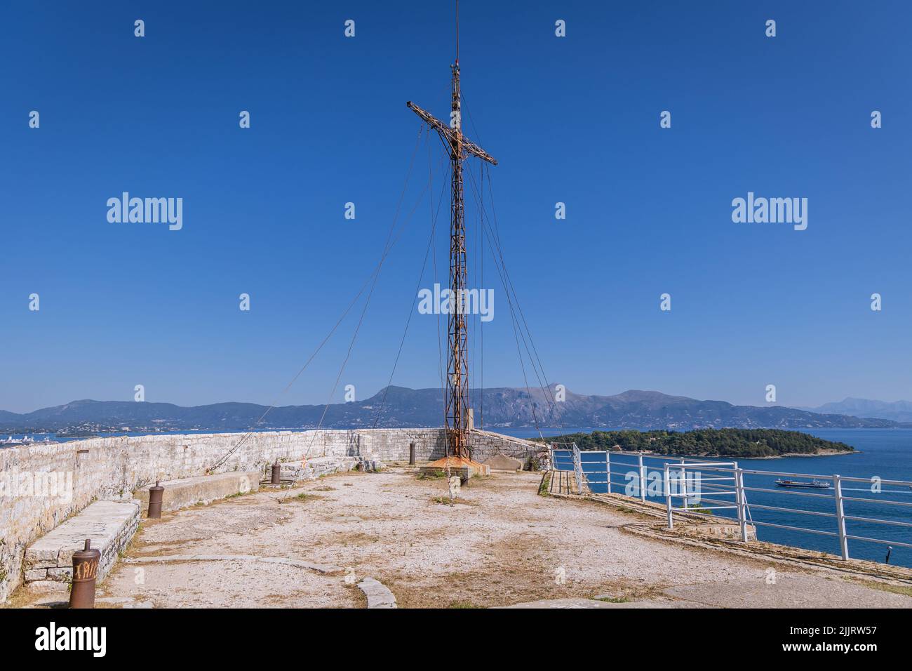 Metal cross on the top of Old Venetian Fortress in Corfu town on a ...