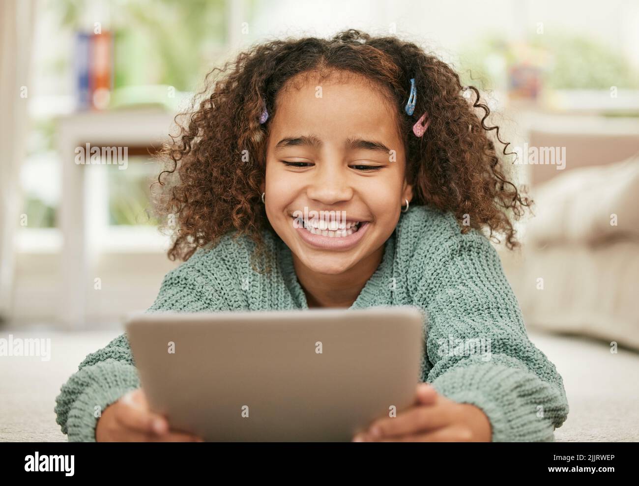 There are many ways of learning now. a little girl using a digital ...