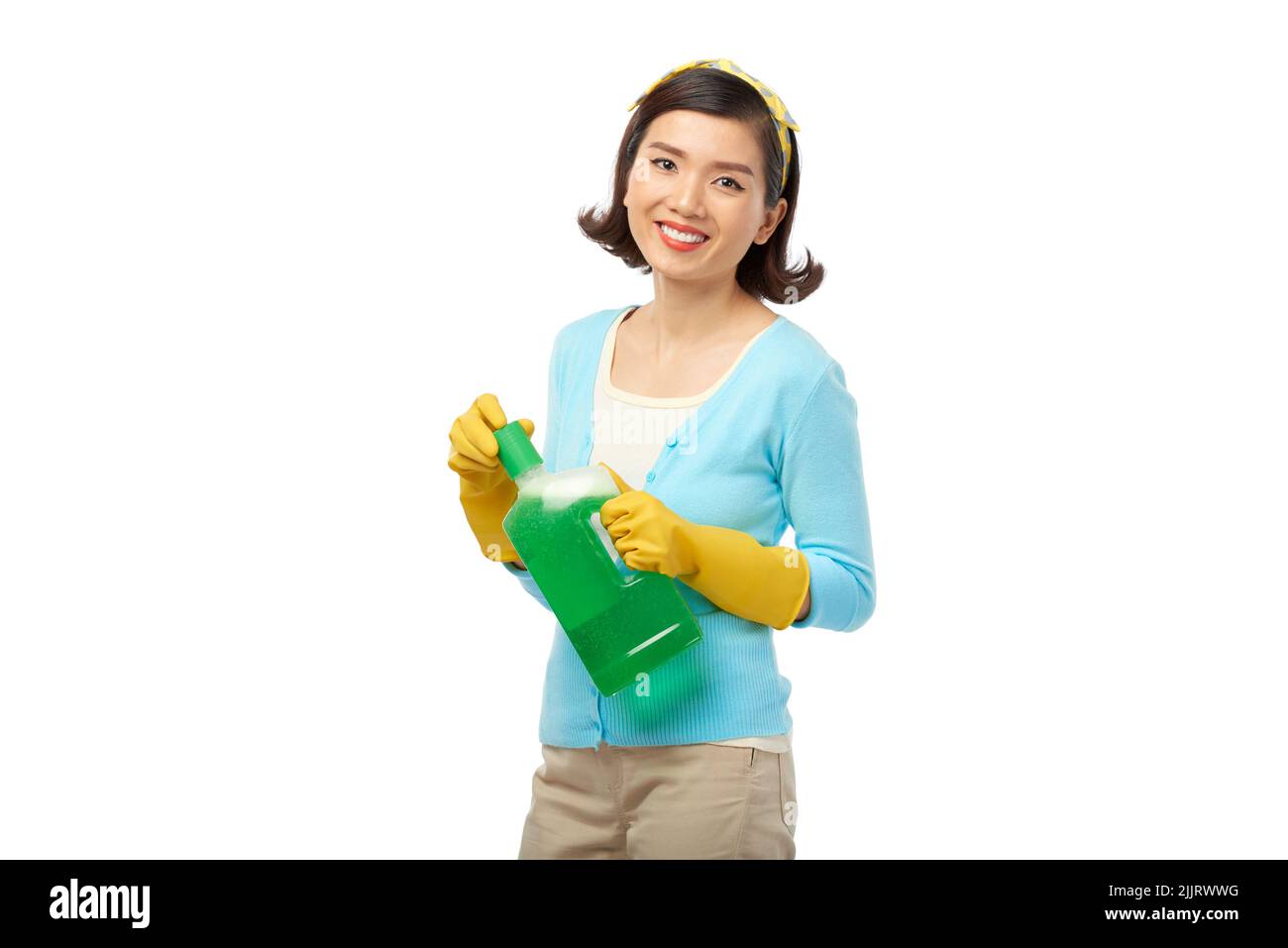 Portrait of pretty young housewife with charming smile posing for ...