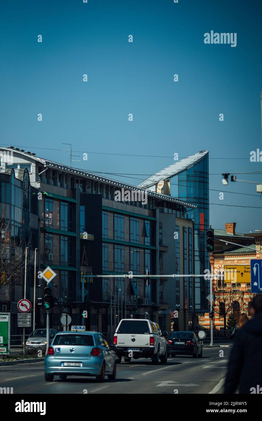 A vertical shot of cars driving on the street in the daytime Stock ...