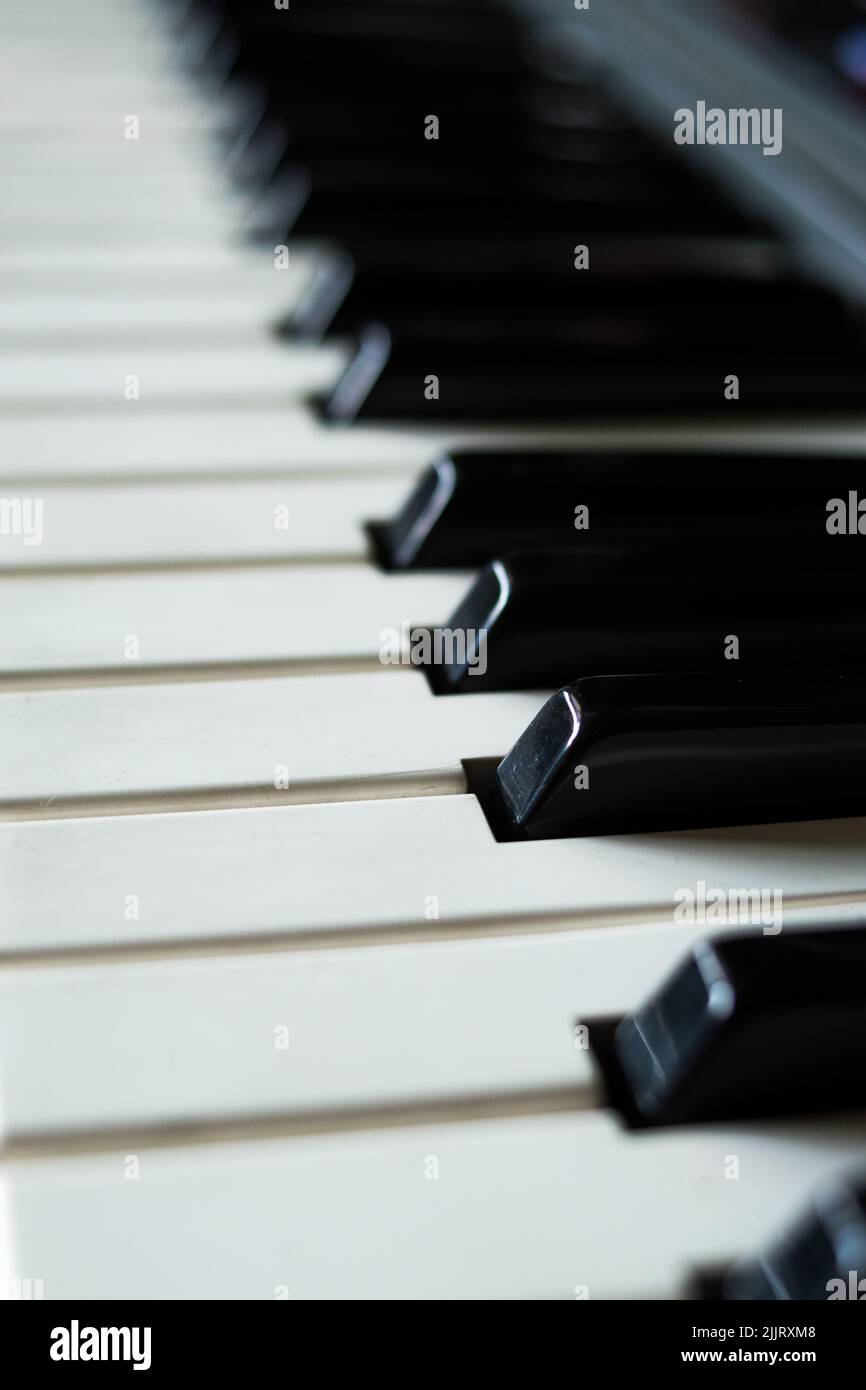 A vertical closeup of a detail of black and white piano keys Stock ...