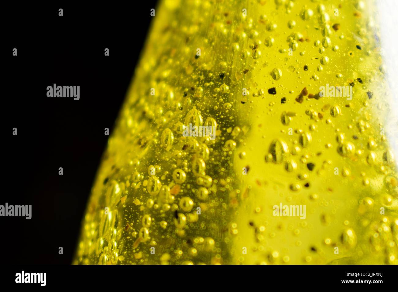 A macro shot of yellow substance background with bubbles Stock Photo ...