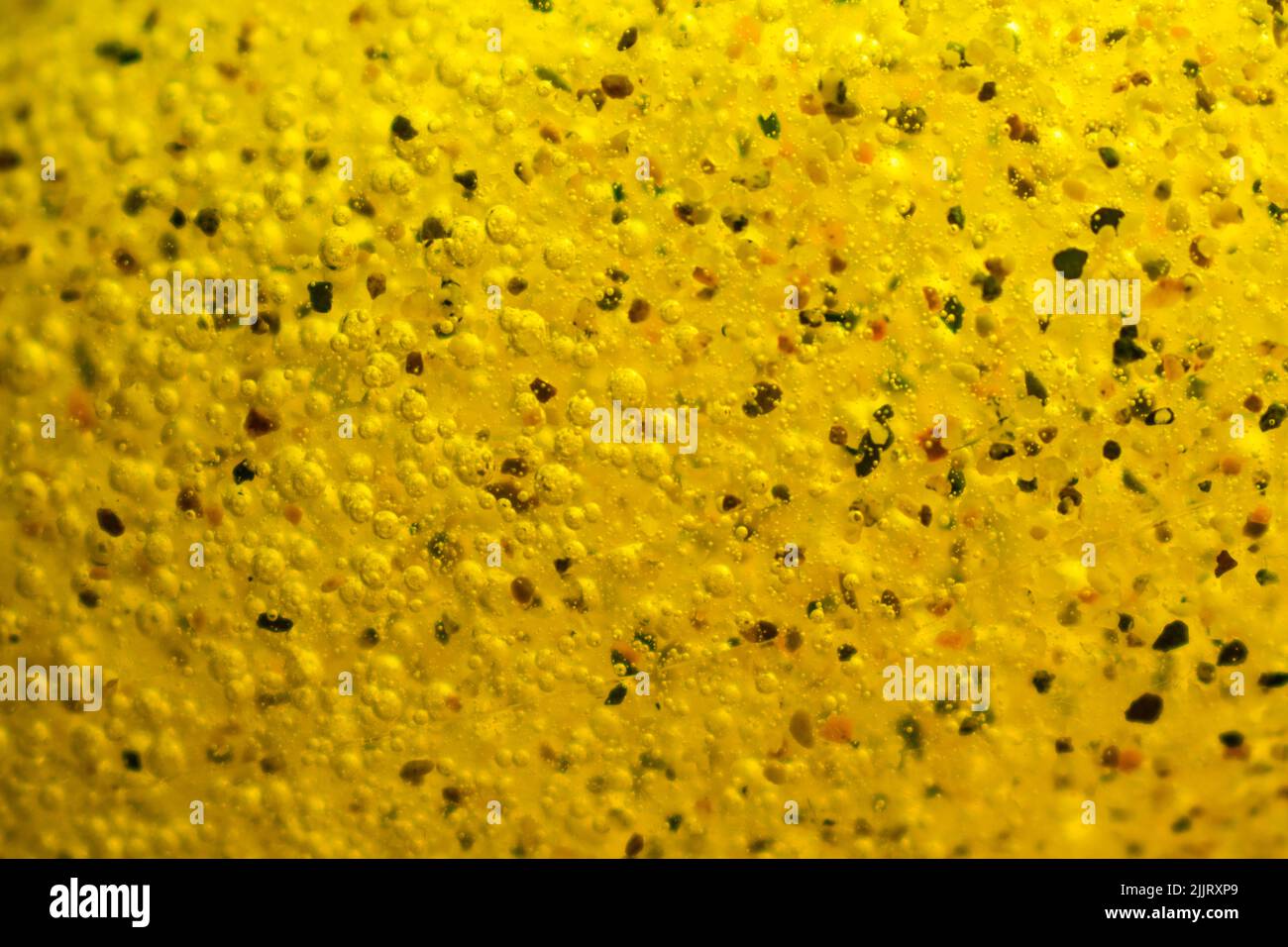 A macro shot of yellow substance background with bubbles Stock Photo ...