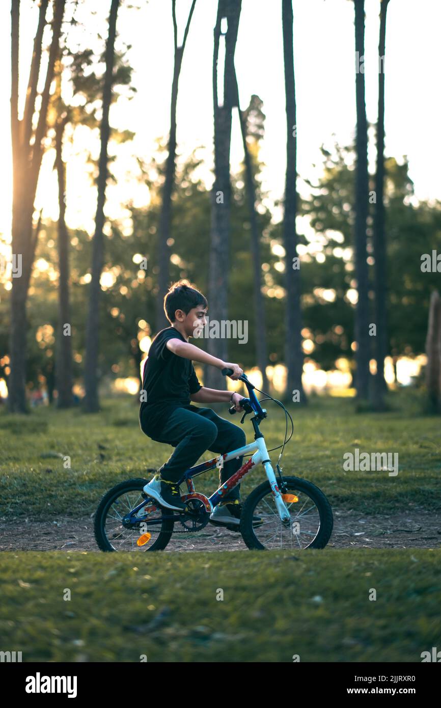 Boy riding his bicycle hi-res stock photography and images - Alamy