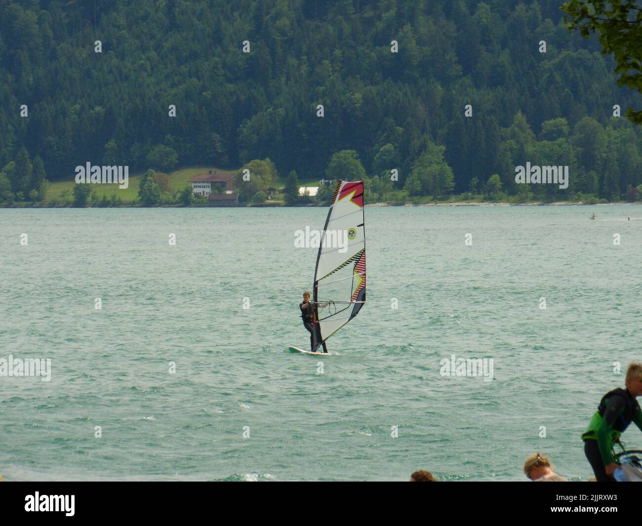 A person windsurfing at Walchensee in the German Alps Stock Photo - Alamy