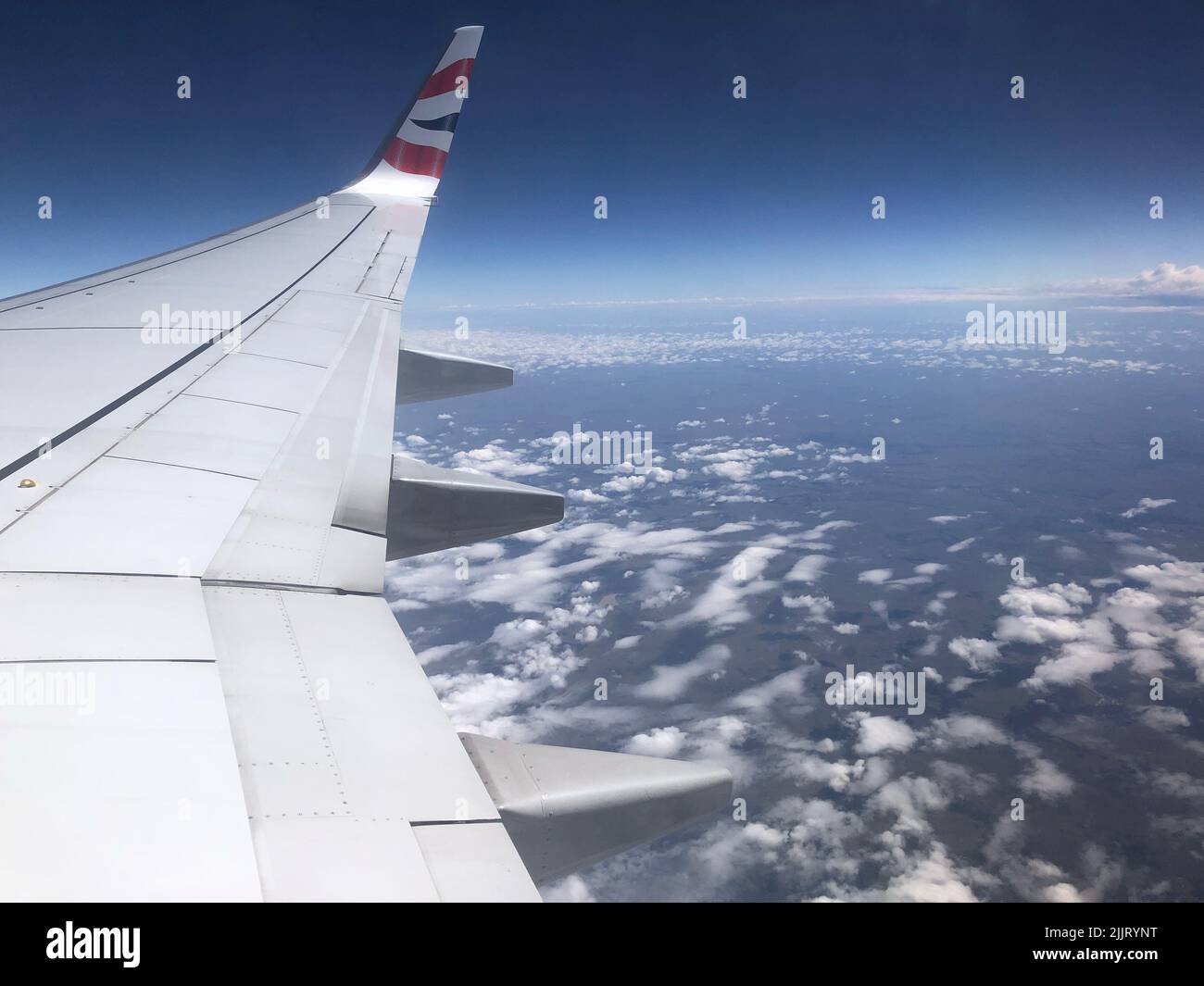 A closeup of British airways wing flying on the sky Stock Photo - Alamy