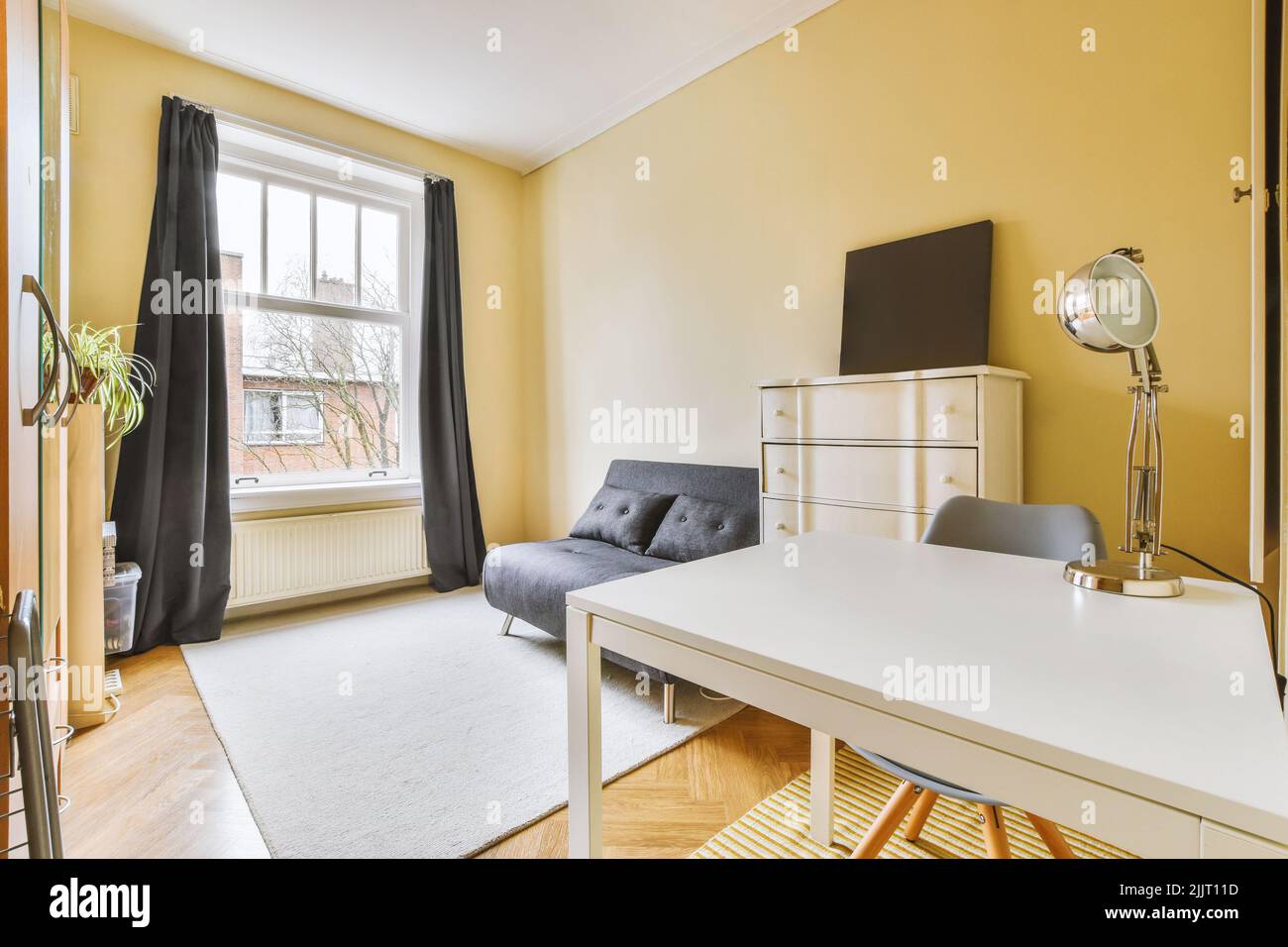 Minimalist interior of study room with parquet floor and white walls ...