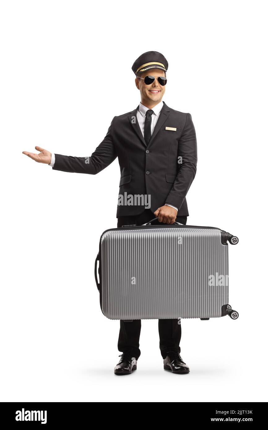 Professional chauffeur carrying a suitcase and gesturing with hand ...