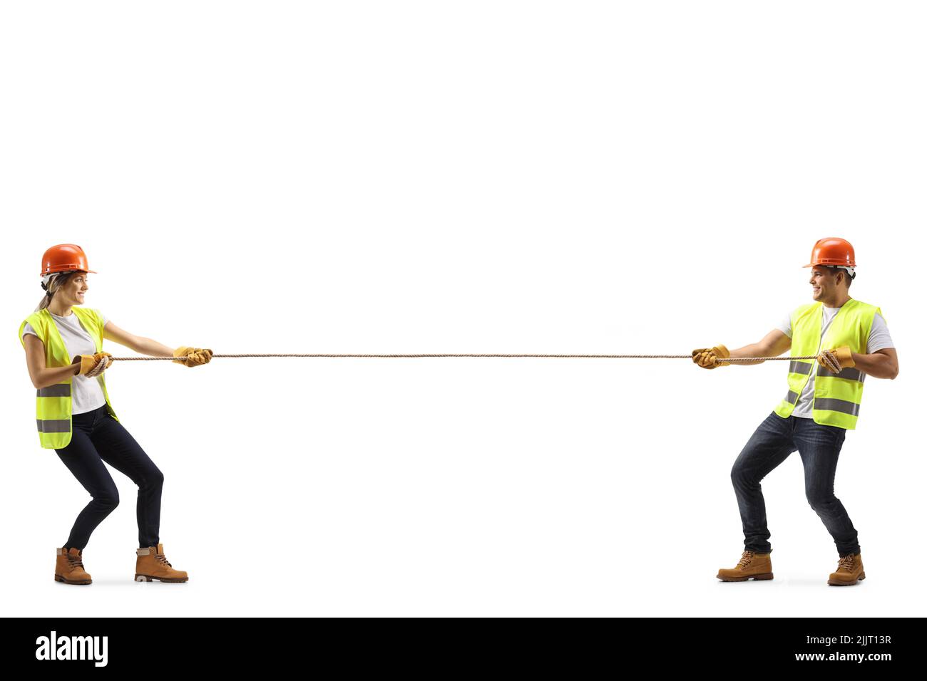 Full length profile shot of a male and female construction worker ...