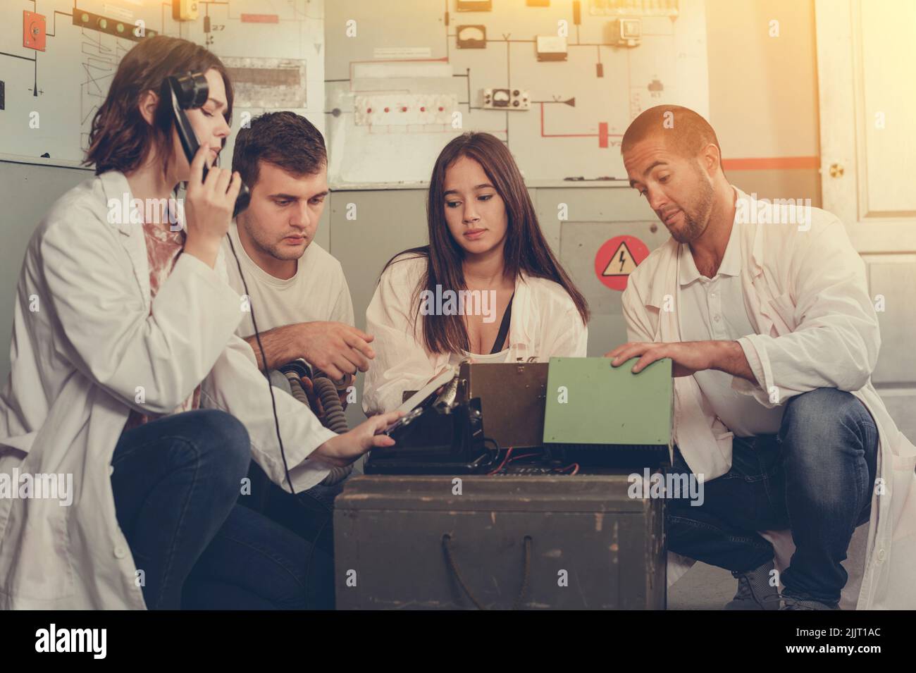 Young people in lost room-bunker Stock Photo - Alamy